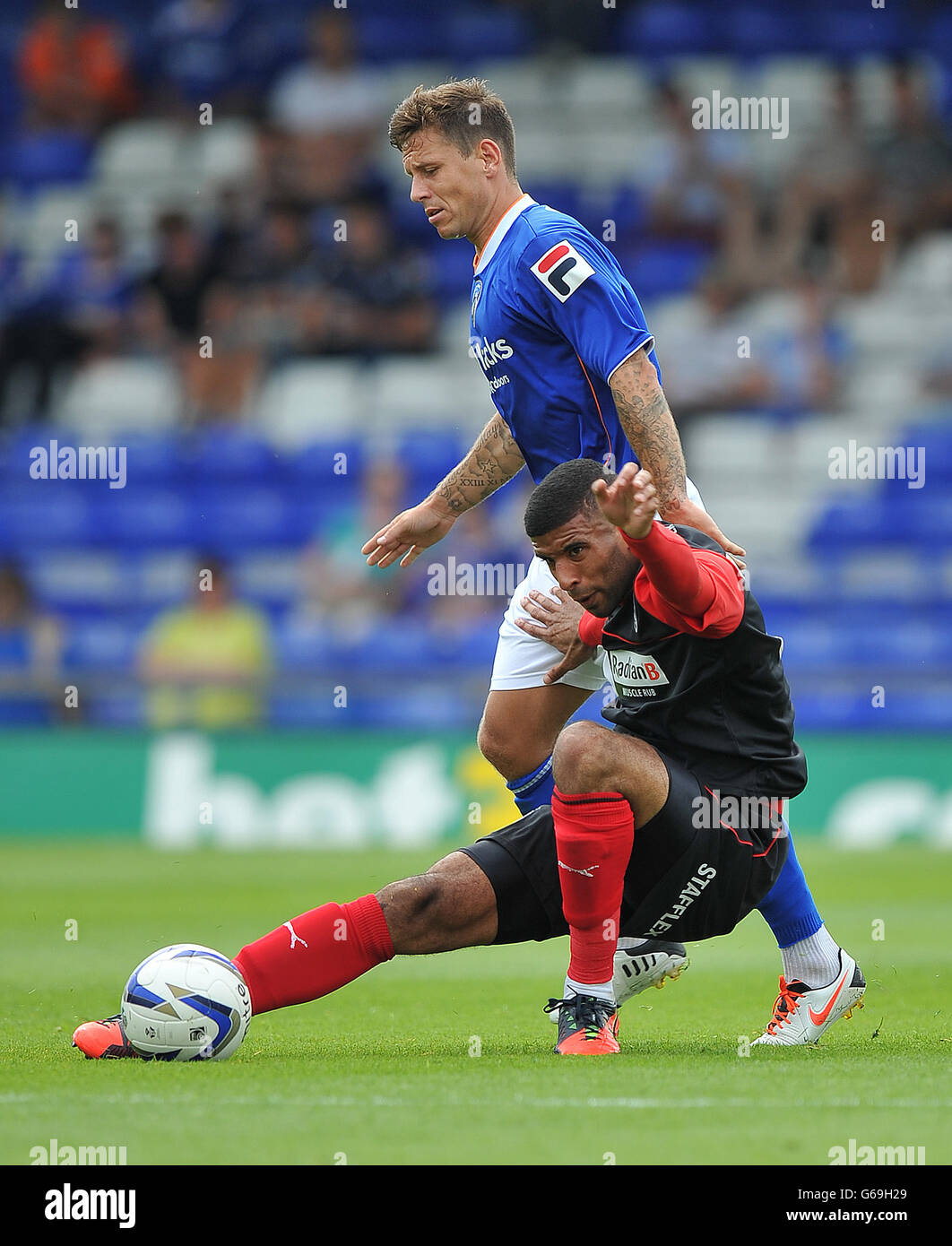 Oldham Athletic's Charlie McDonald and Huddersfield Town's Oscar Gobern ...