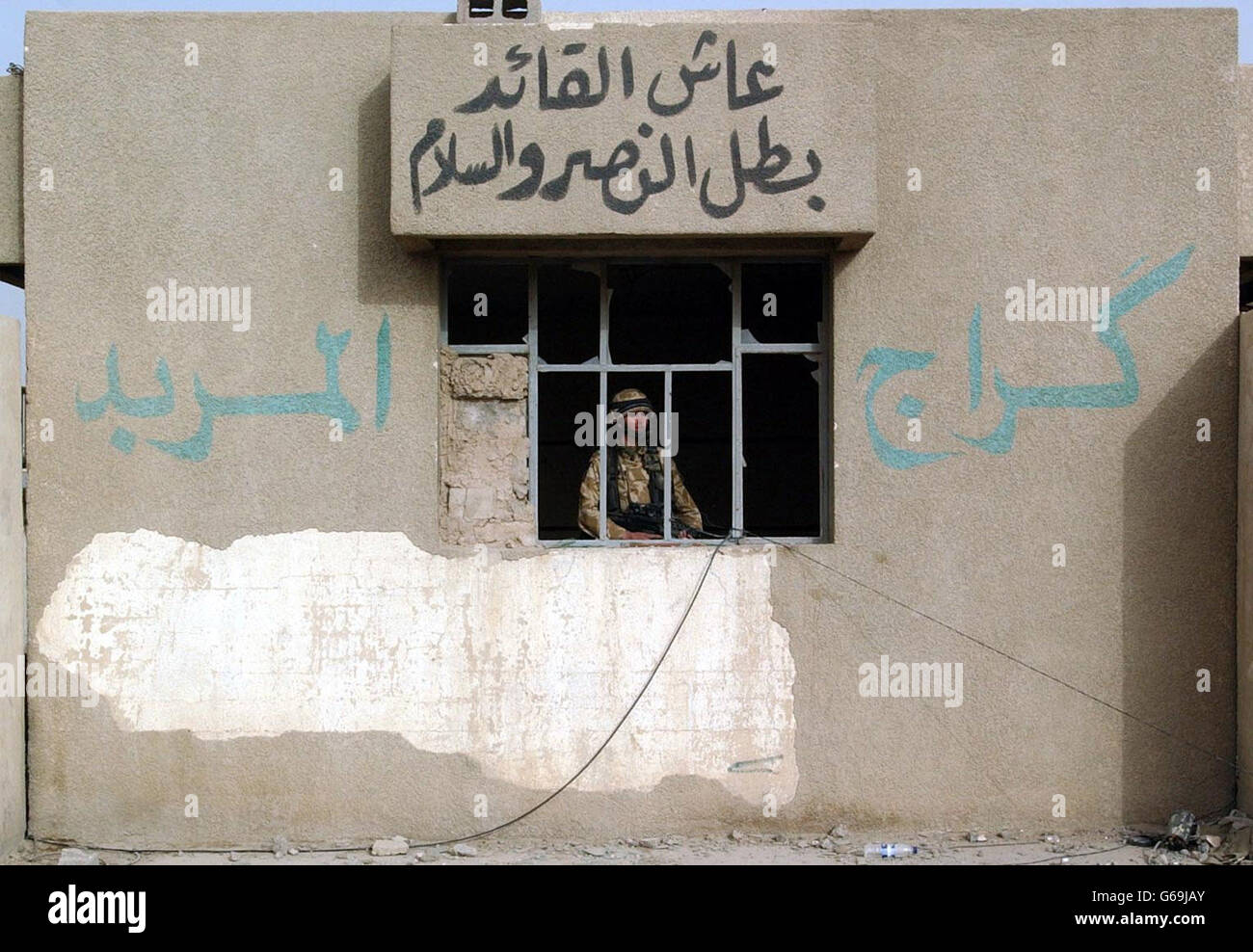 A Desert Rat stands guard as residents flee Basra. The net was closing ...