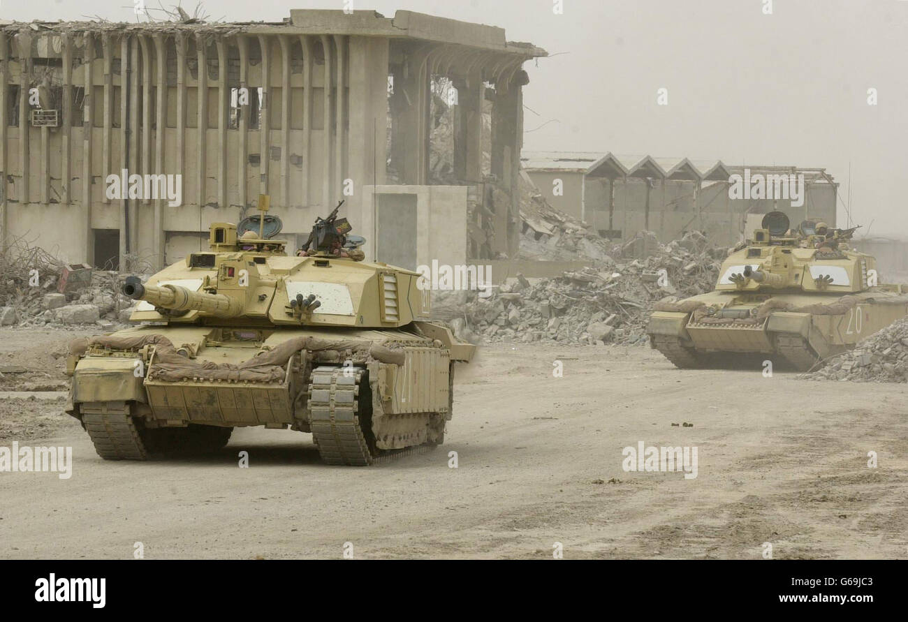British Challenger II tanks on the move as residents flee Basra. The ...