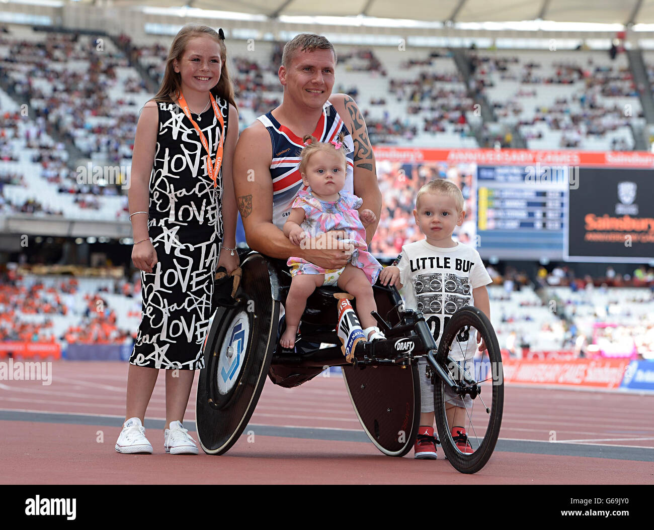 Great Britain's David Weir celebrates with his children Ronie, Tillia ...