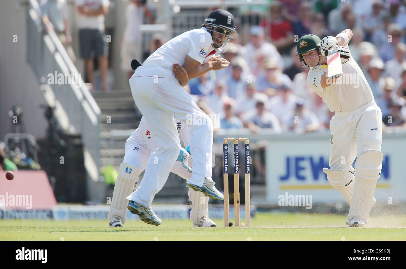 Australia batsman Steve Smith hits past England captain Alastair Cook ...