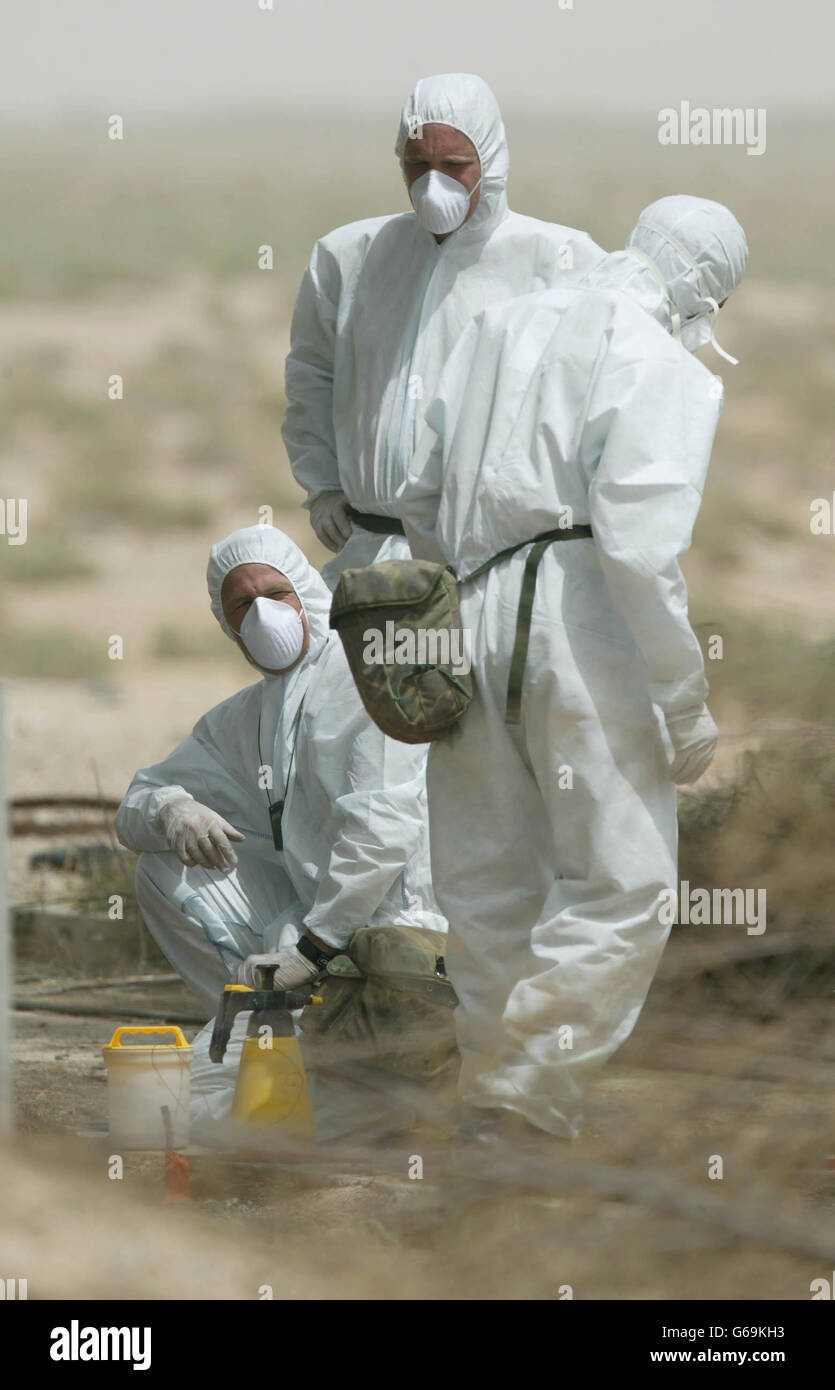 Picture made available of Army chemical weapons experts examining one ... Picture made available of Army chemical weapons experts examining one ...