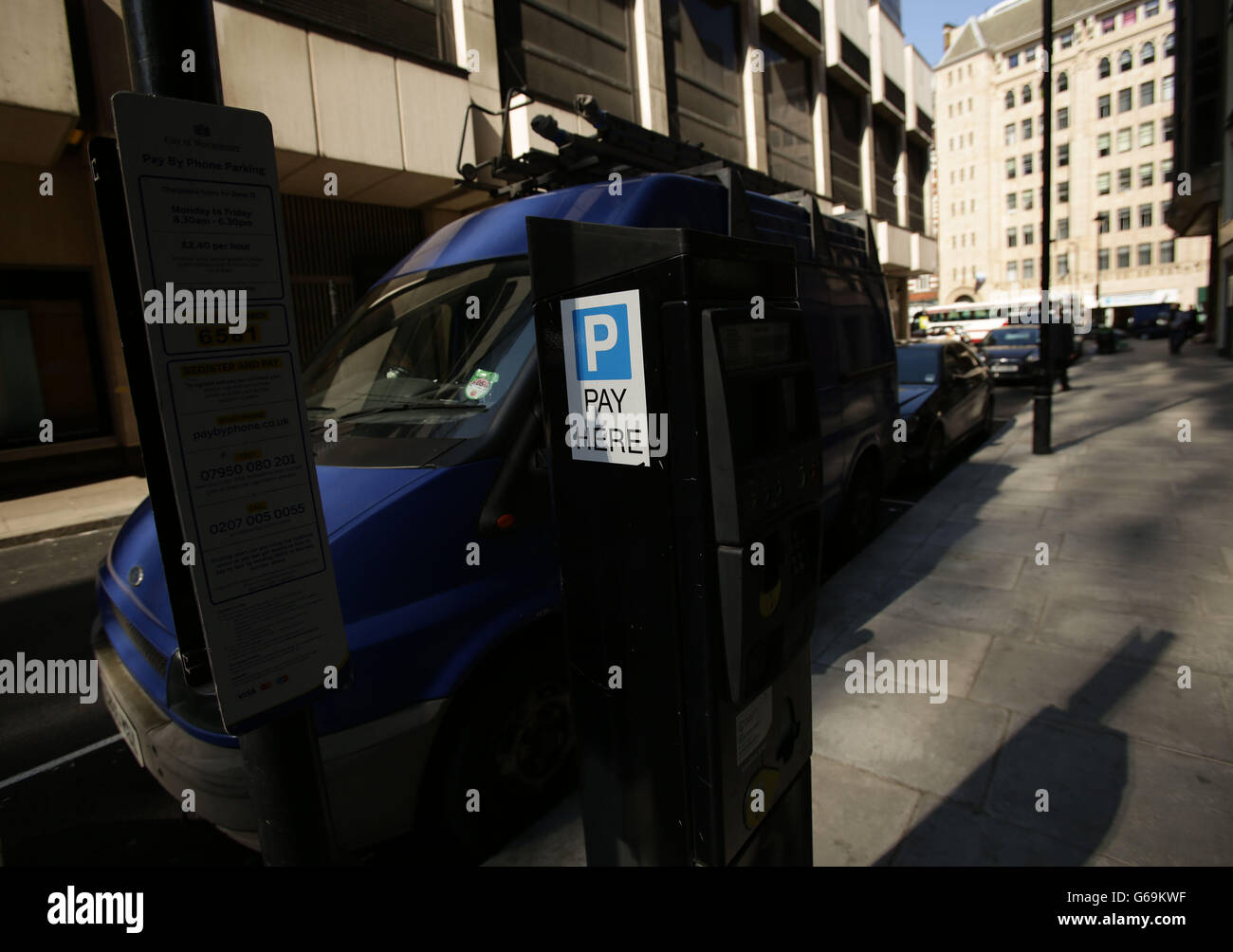 A parking sign and parking meter on the street in Westminster, central ...