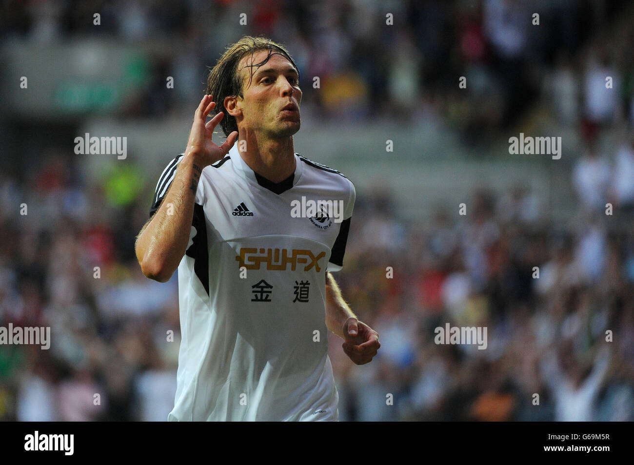 Swansea's Miguel Michu celebrates scoring during the Europa League ...