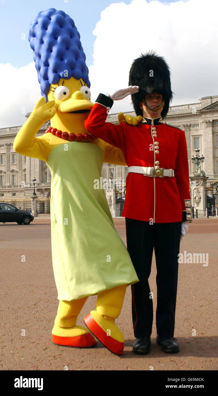 Marge Simpson poses with a 'guardsman' during a photocall outside ...