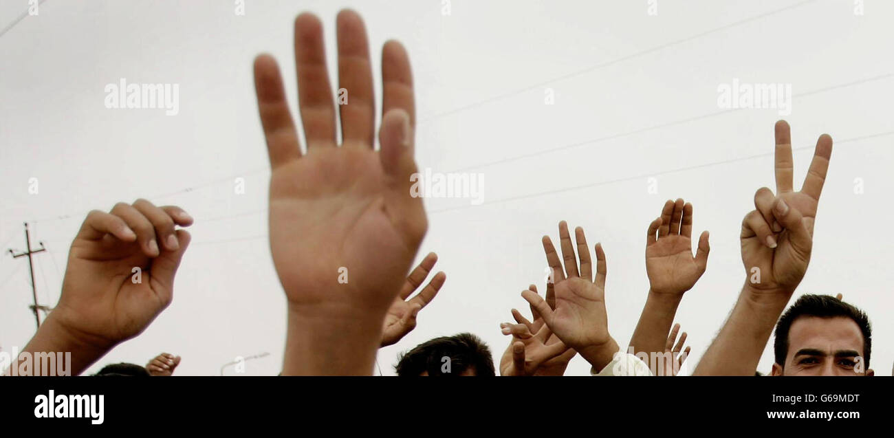 Crowds celebrate at Ba'ath Party HQ Stock Photo - Alamy