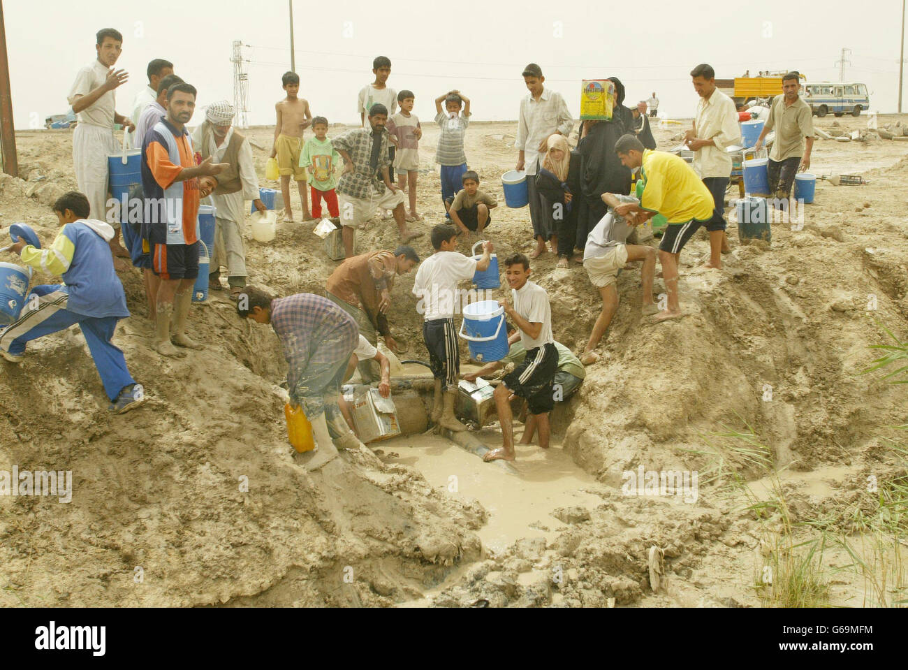 Iraqi's from a poor suburb of Basra, in southern Iraq, find a salt ...