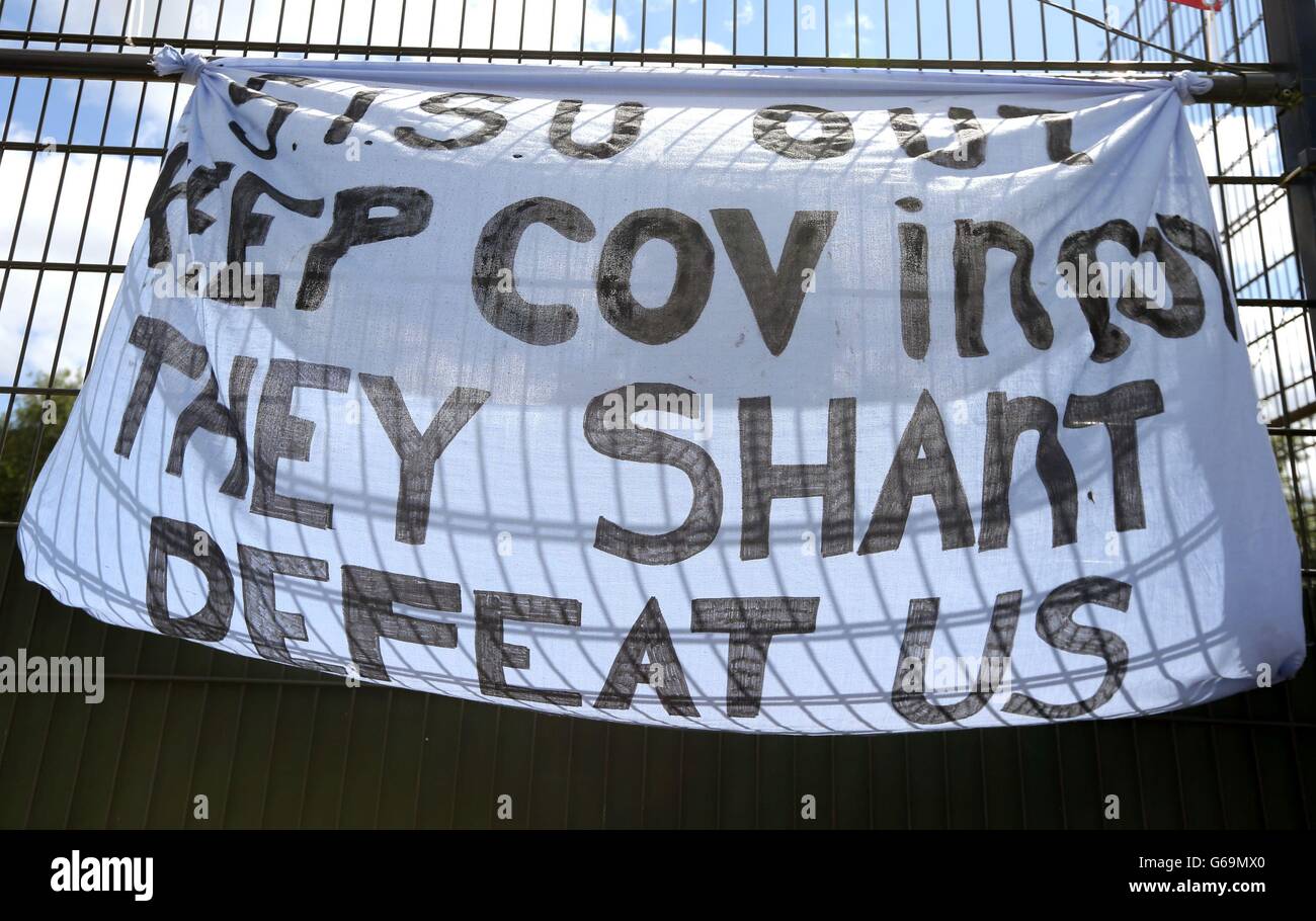 A banner is shown on display outside the stadium protesting against the ...