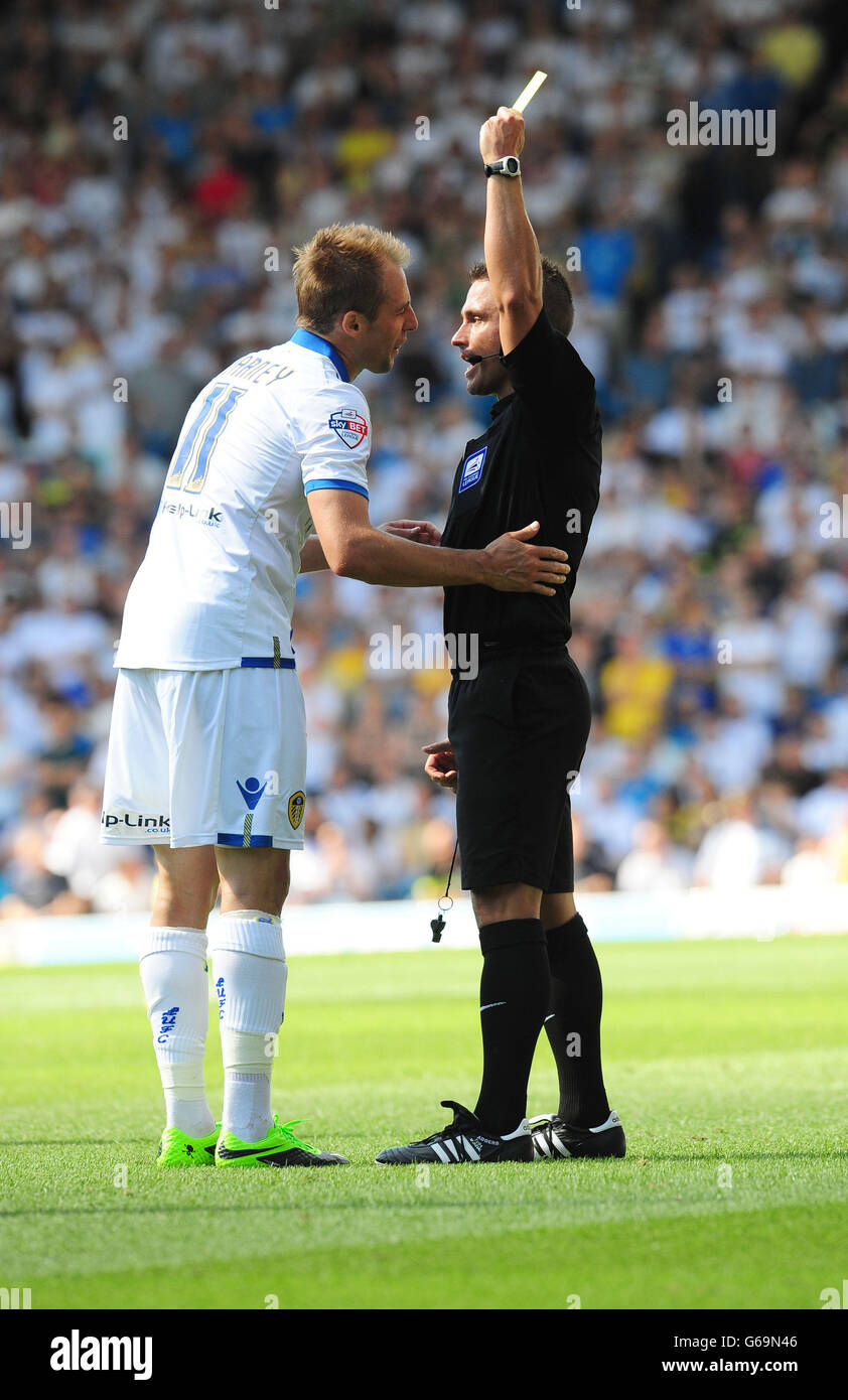 Leeds United's Luke Varney is booked by referee James Adcock during the ...
