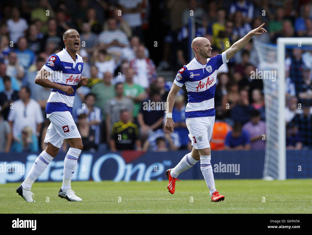 QPR's Andrew Johnson (right) celebrates scoring his side's second goal ...