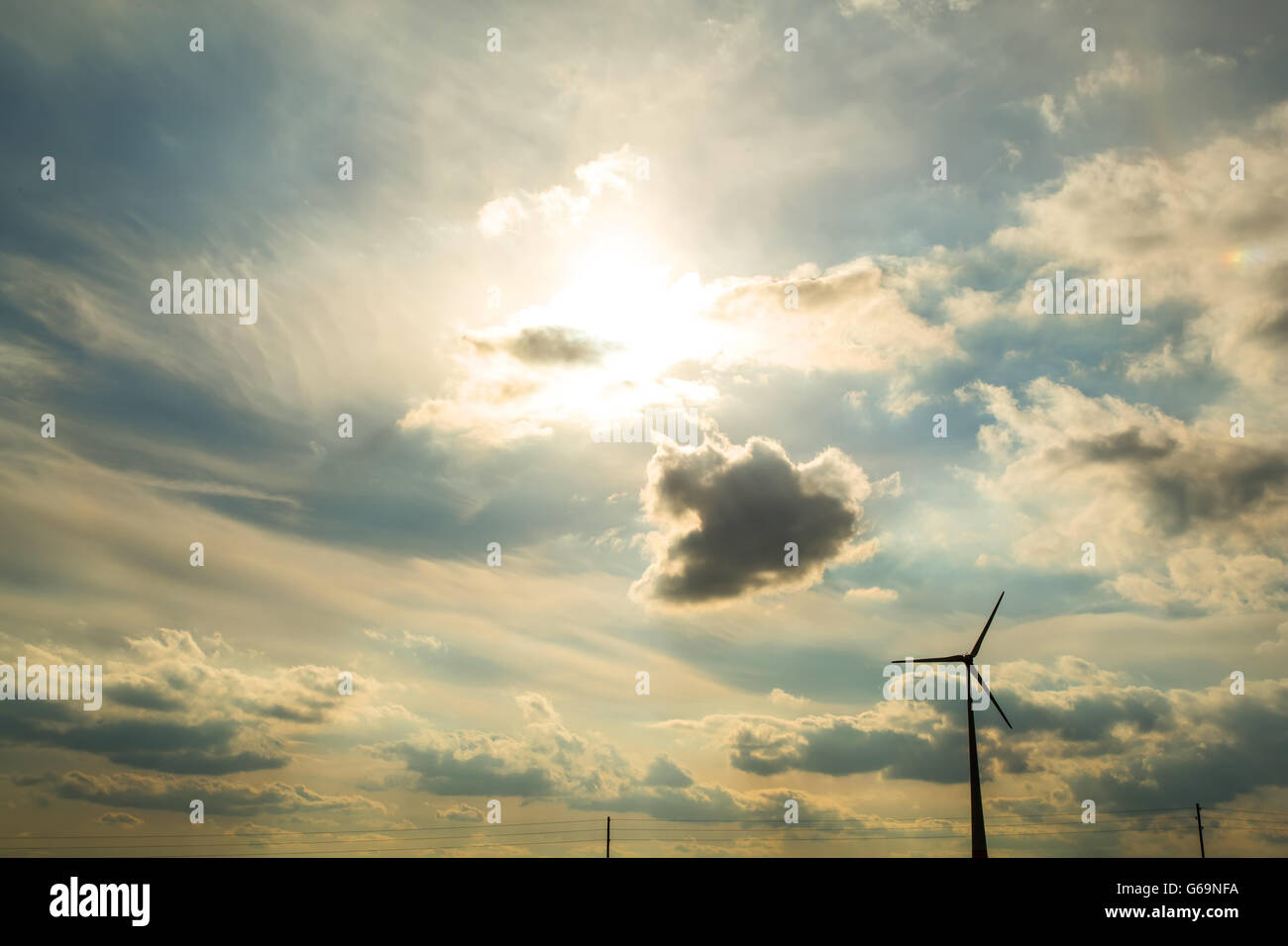 Wind turbine under a dramatic sky Stock Photo - Alamy
