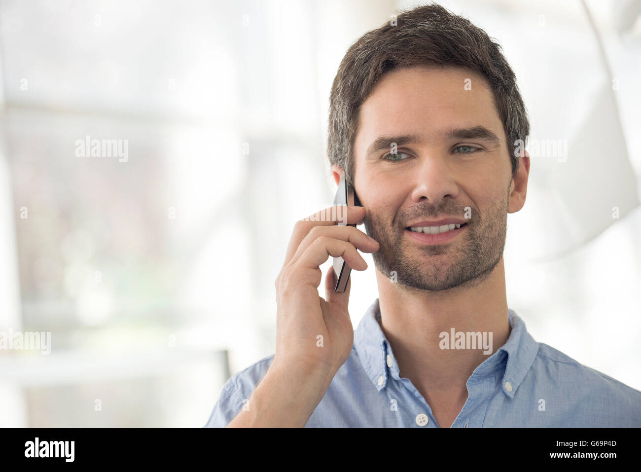 Talking on cell phone, portrait Stock Photo - Alamy