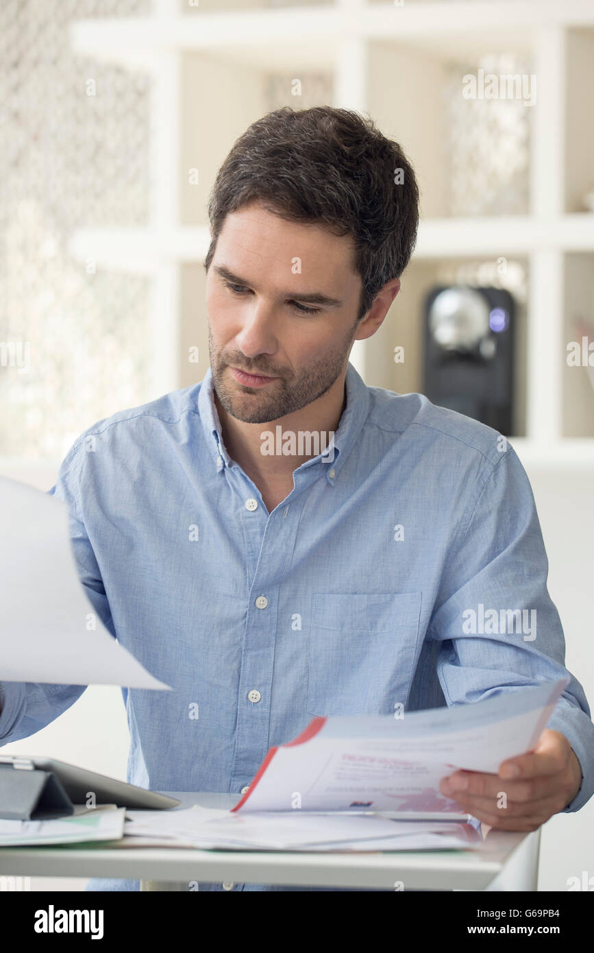 Paying bills man invoices hi-res stock photography and images - Alamy
