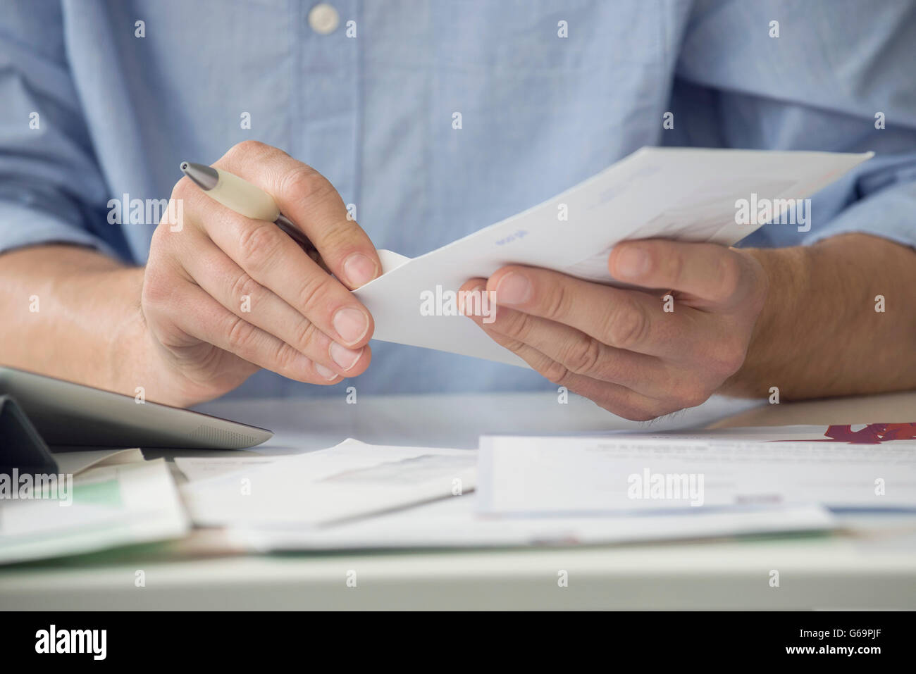 Man opening mail Stock Photo - Alamy