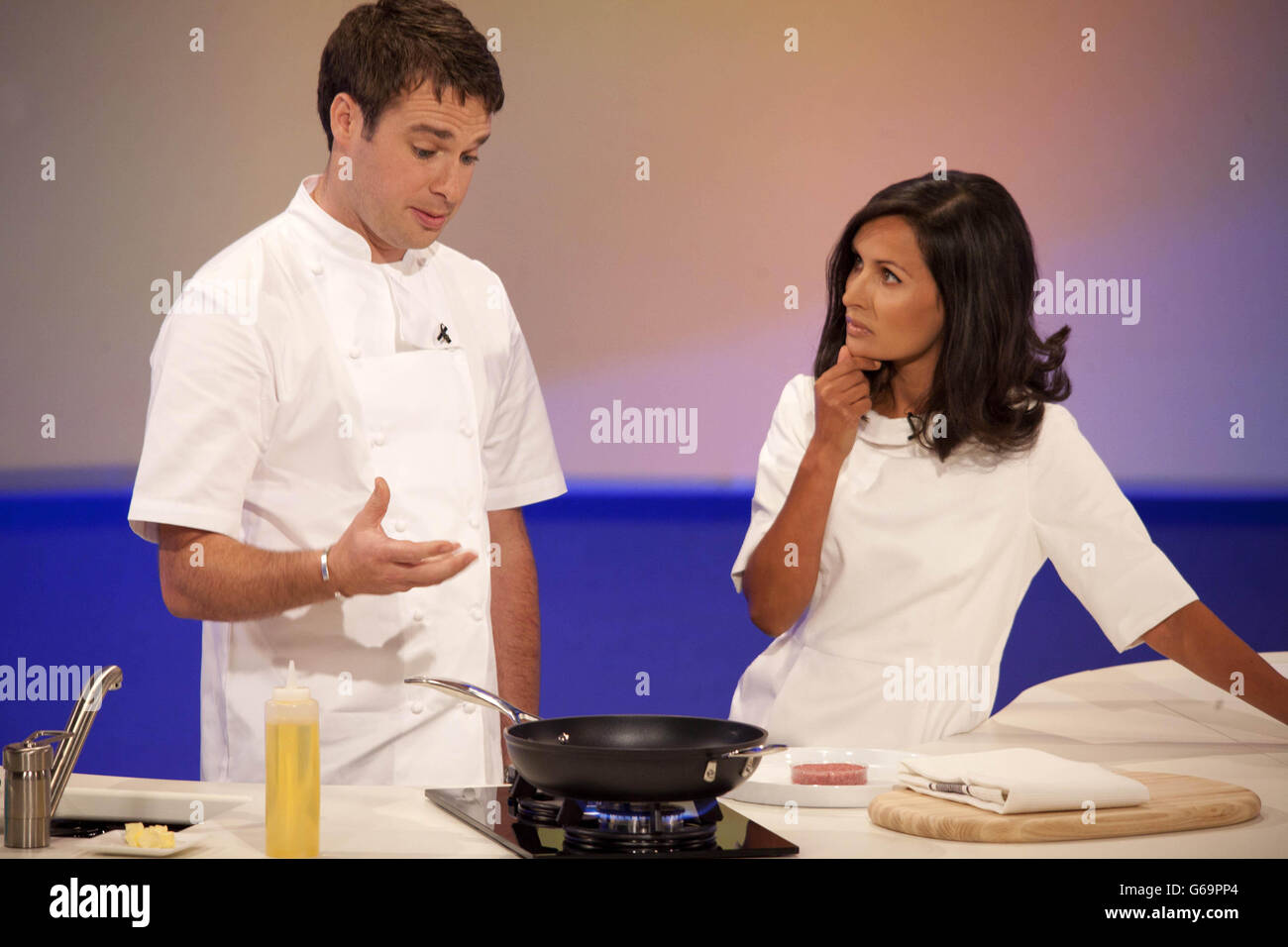 News Presenter Nina Hossain watches Chef Richard McGeown prepare a ...