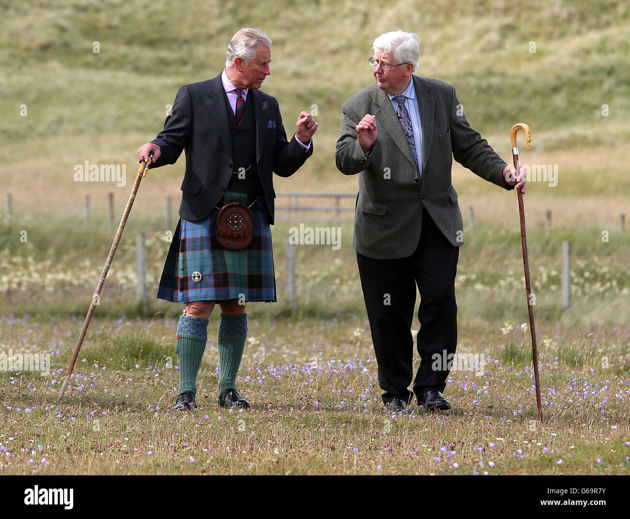 The Prince of Wales walks alongside Hamish Pottinger (right) the owner of Greenland Meadow ...