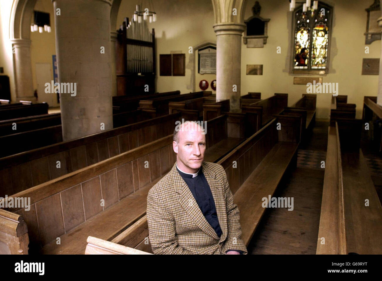 Rev andrew gair sits in his debden parish church hi-res stock ...