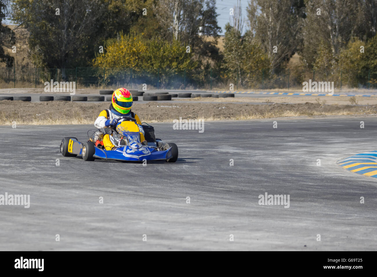 Karting - driver in helmet on kart circuit Stock Photo - Alamy