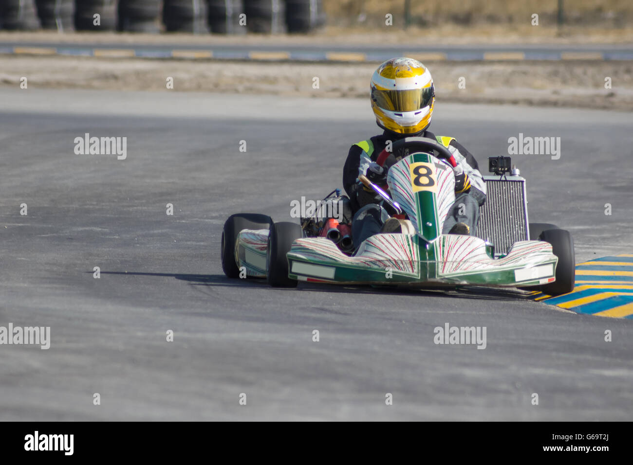 Karting - driver in helmet on kart circuit Stock Photo - Alamy