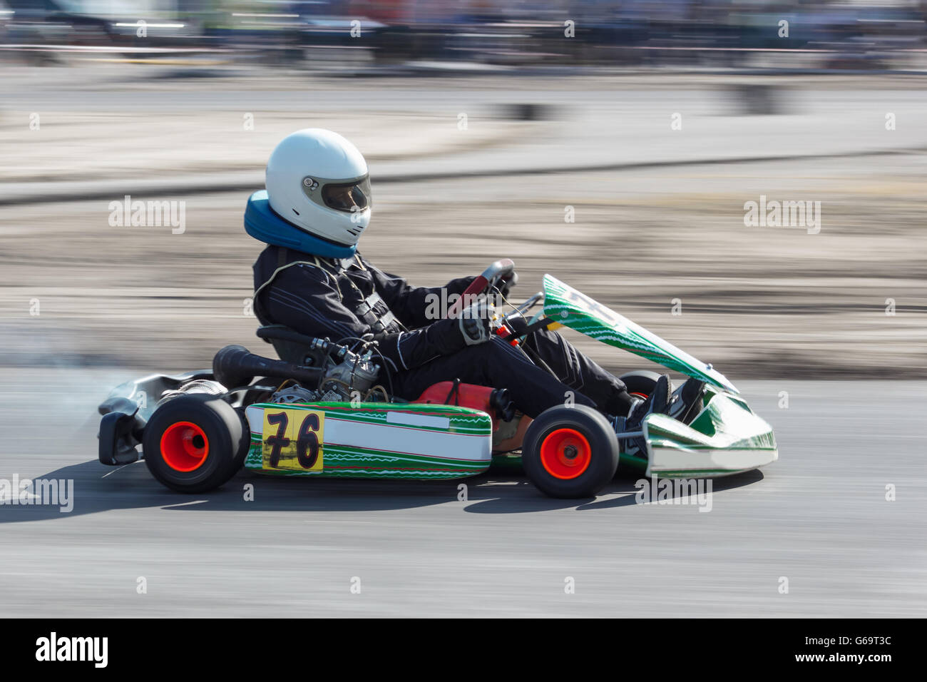 Karting - driver in helmet on kart circuit Stock Photo - Alamy
