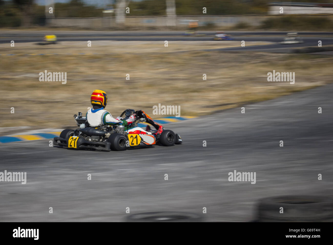 Karting - driver in helmet on kart circuit Stock Photo - Alamy