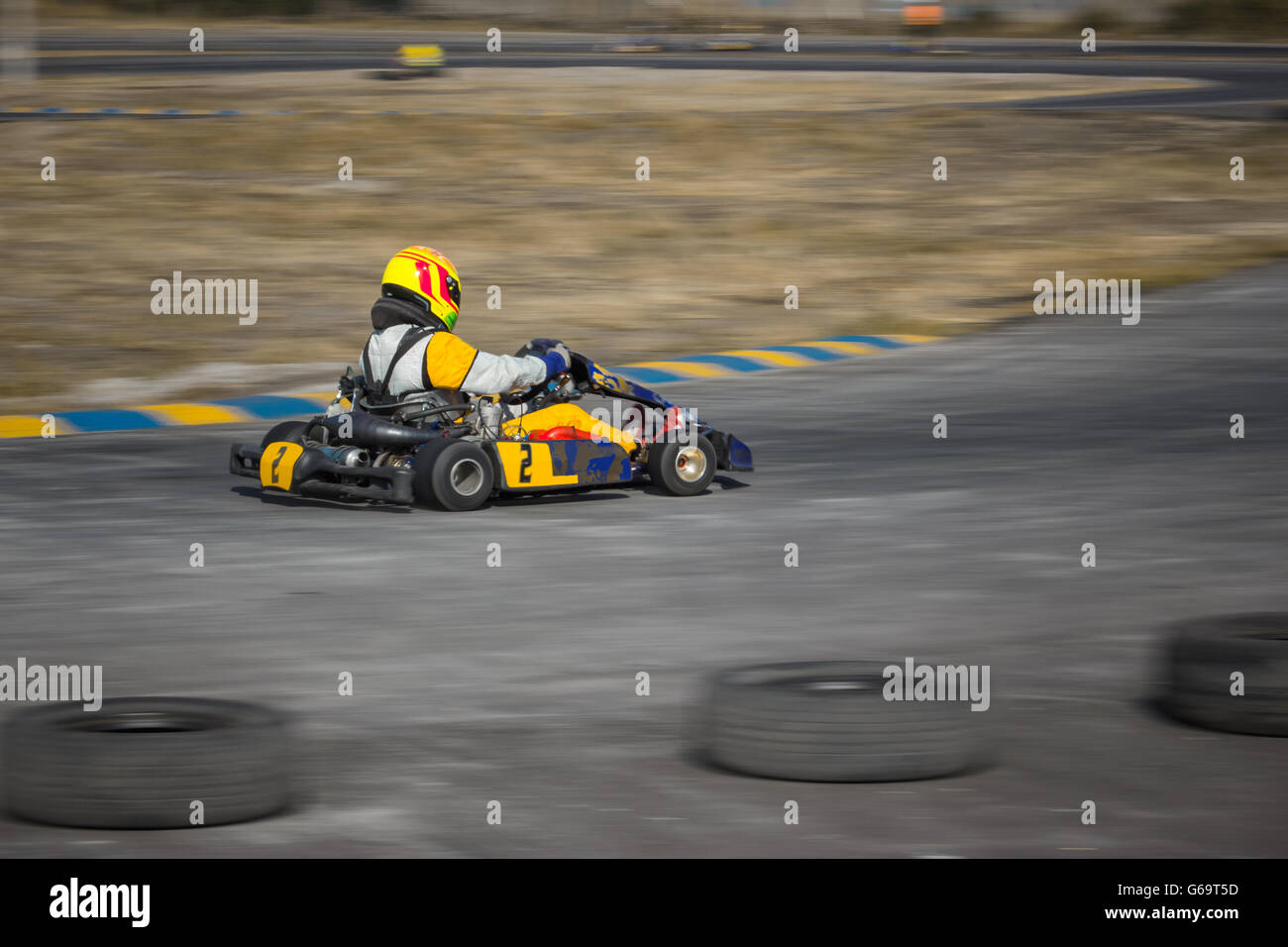Karting - driver in helmet on kart circuit Stock Photo - Alamy