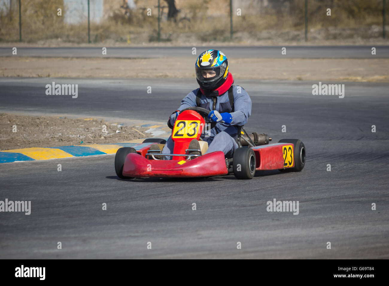 Karting - driver in helmet on kart circuit Stock Photo - Alamy