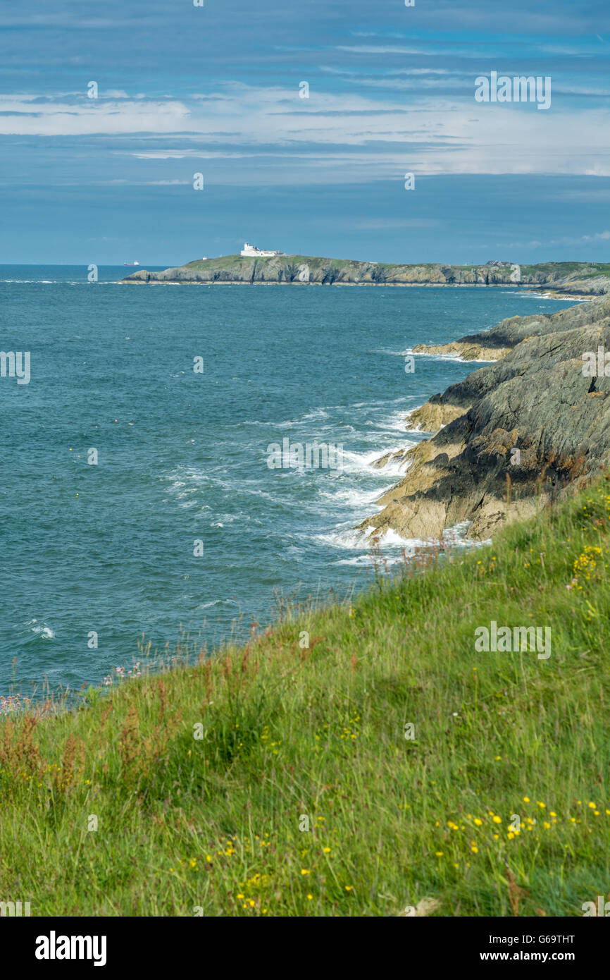 Coastal view from Port Amlwch with Point Lynus lighthouse in the ...