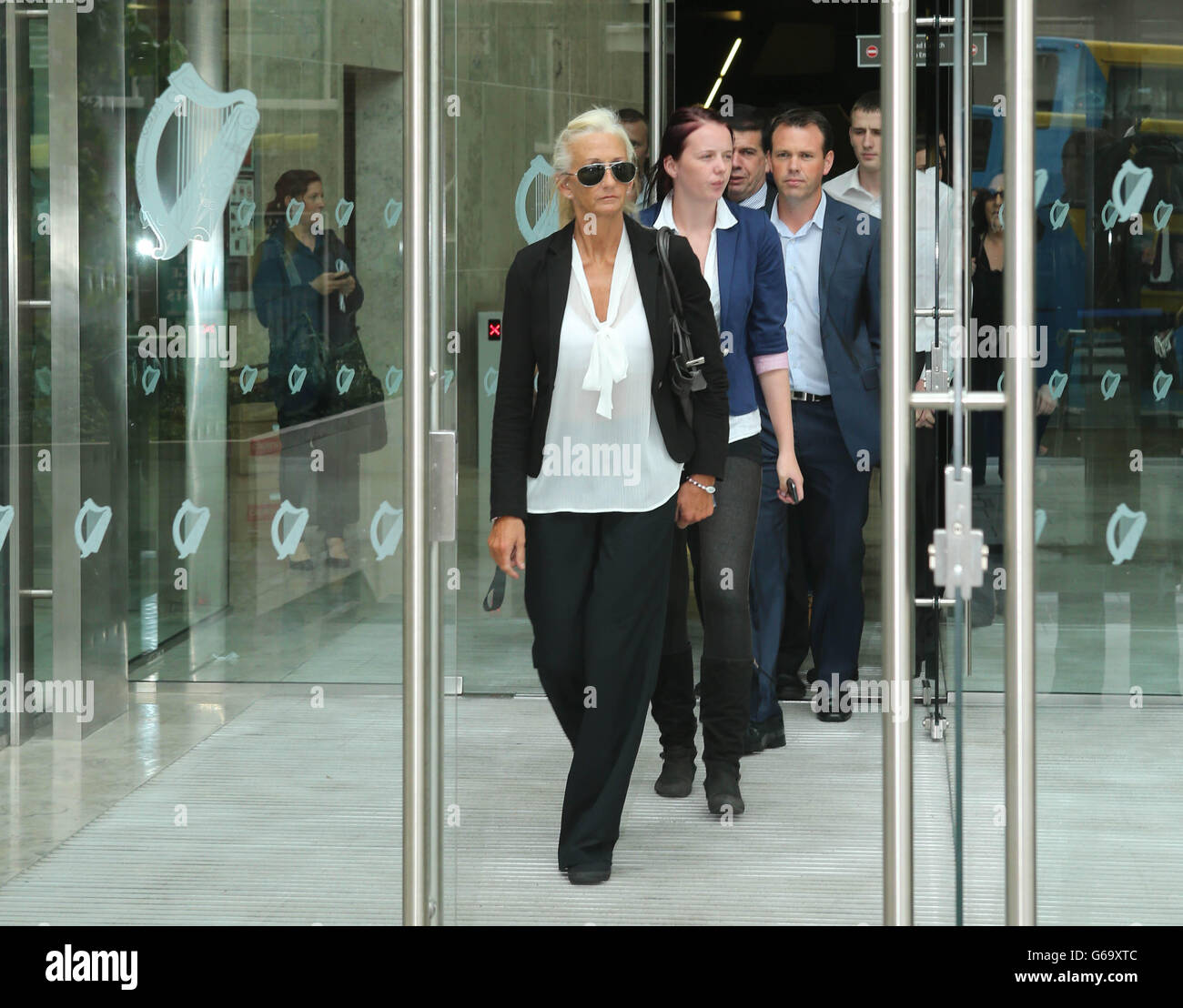 Mary Murray (left) the widow of firefighter Brian Murray leaves Dublin ...