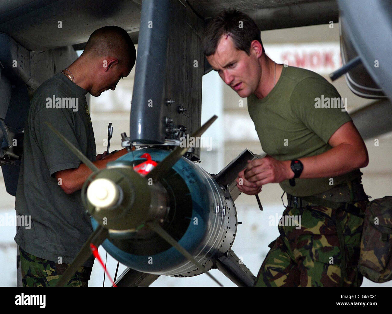 Troops check concrete bomb Stock Photo - Alamy