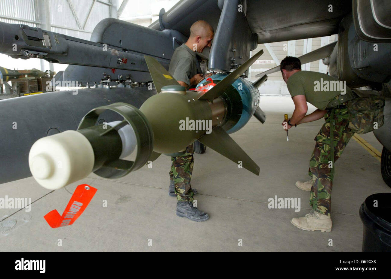 Troops check concrete bomb Stock Photo - Alamy