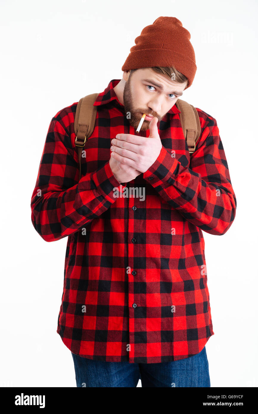 Male hipster smoking cigarette isolated on a white background Stock ...