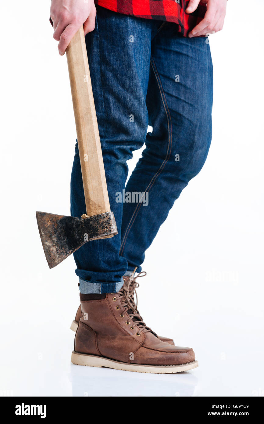 Cropped image of male legs and hands holding axe isolated on the white ...