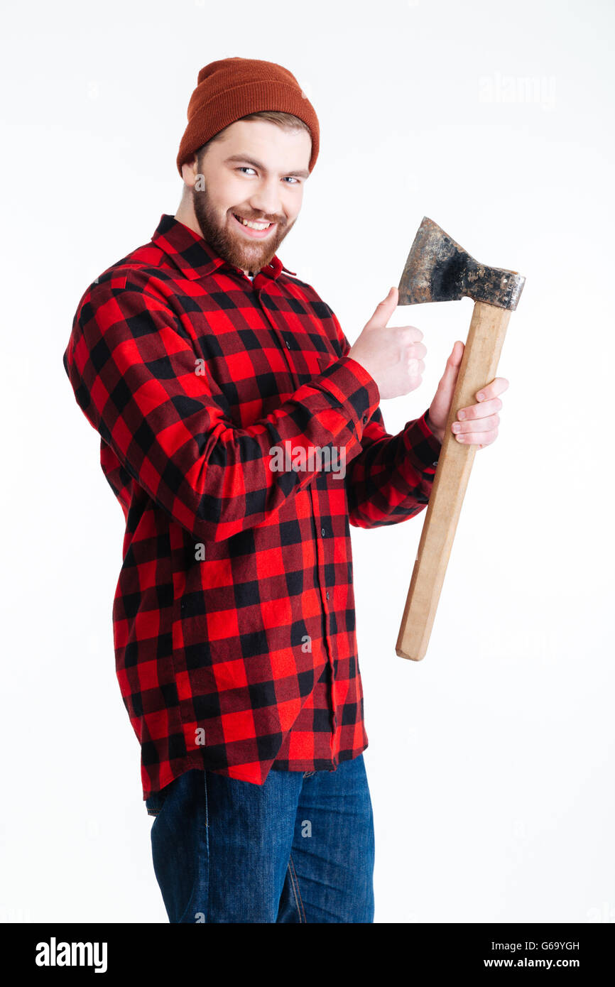 Handsome smiling bearded man holding axe looking at camera isolated on ...