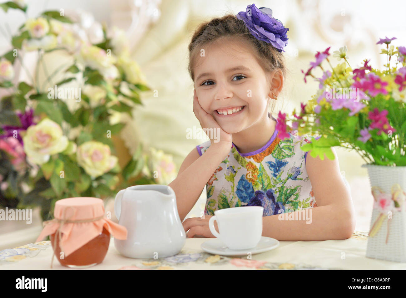 little girl drinking tea Stock Photo - Alamy
