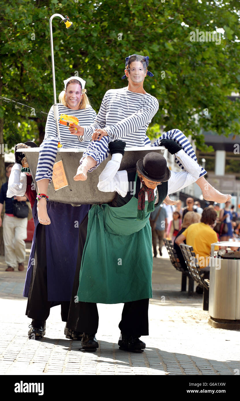 People wearing masks of Jamie Oliver the TV celebrity Chef and Olly ...