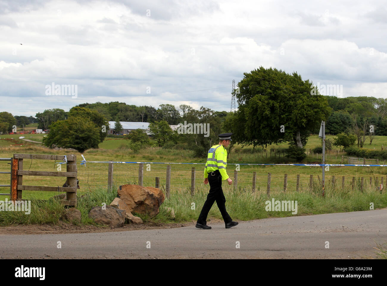 Police at the scene after a father has been shot dead and his son ...