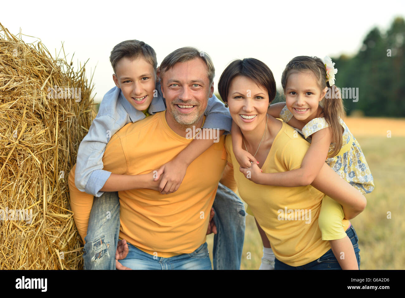 happy family at field Stock Photo - Alamy
