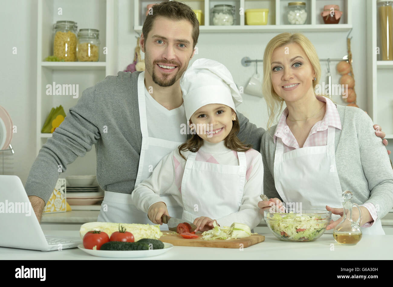 happy family cooking in kitchen Stock Photo - Alamy