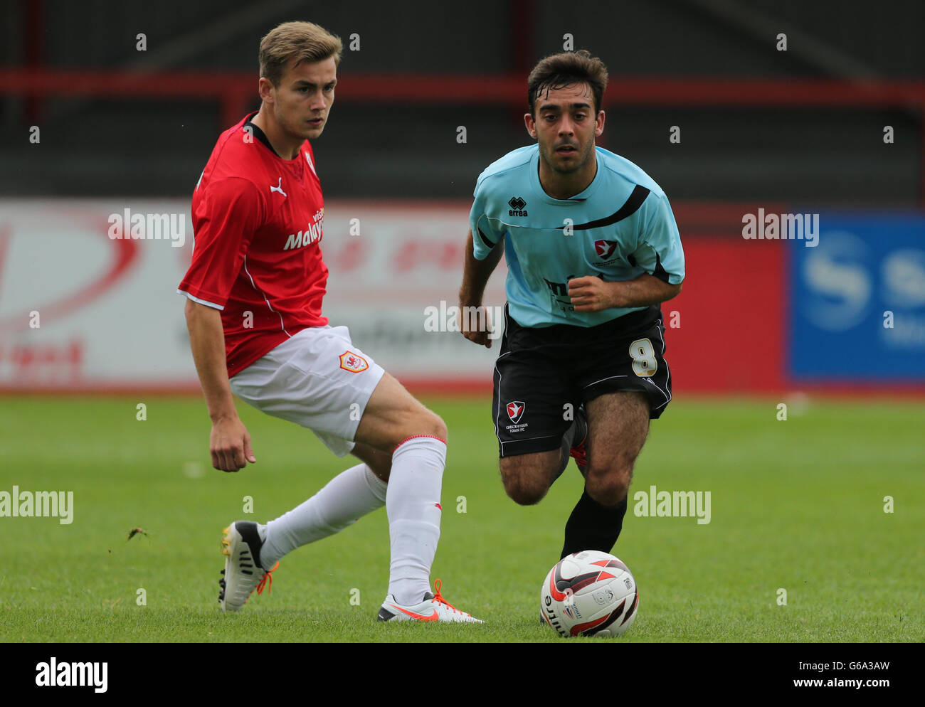 Cardiff City's Joseph Ralls (left) and Cheltenham Town's Sam Deerling ...