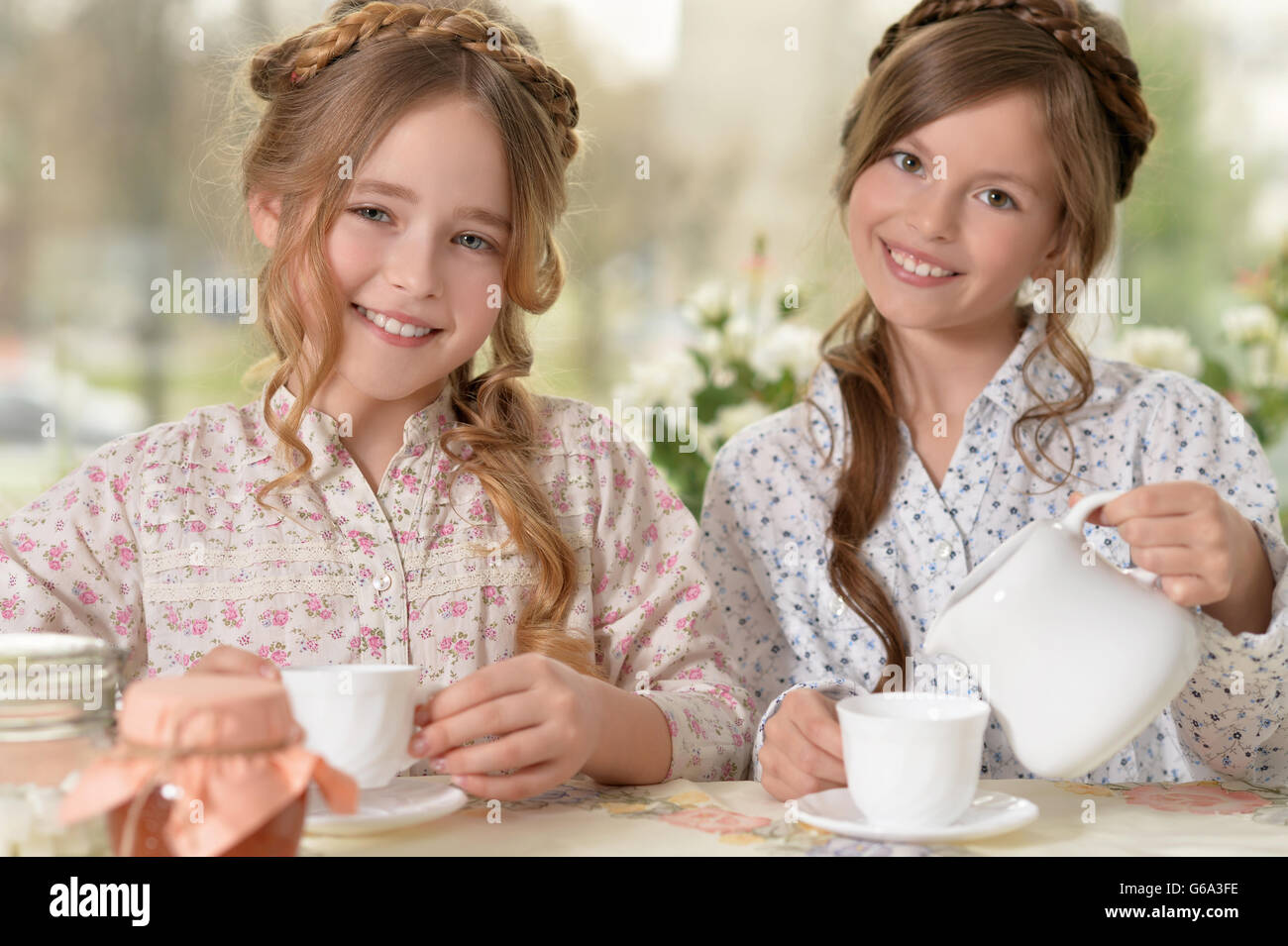 little girls drinking tea Stock Photo - Alamy
