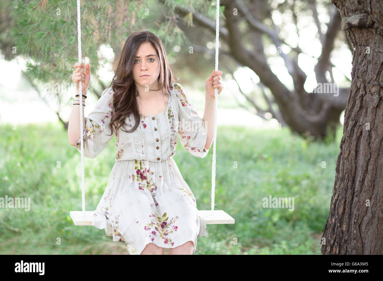 Woman on rope swing hi-res stock photography and images - Alamy