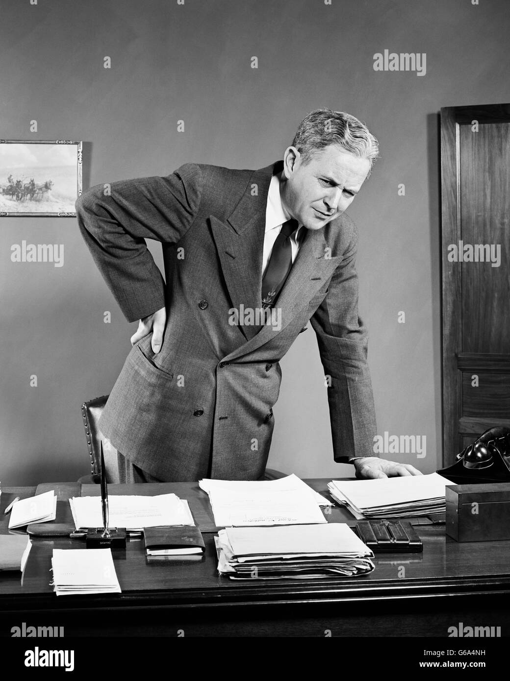 Middle aged businessman spinal pain hi-res stock photography and images ...