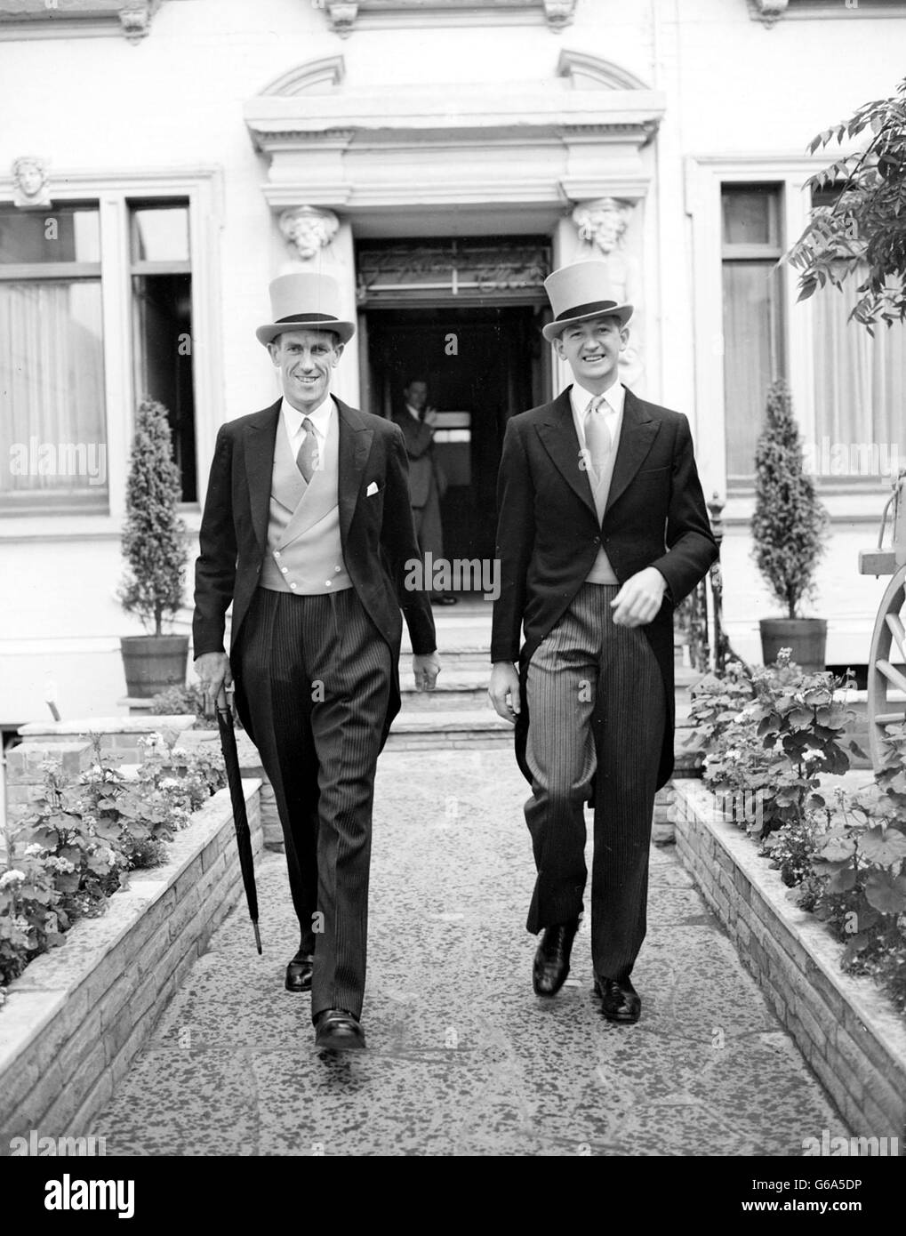 Hillary and Lowe go to Royal Garden Party Stock Photo - Alamy