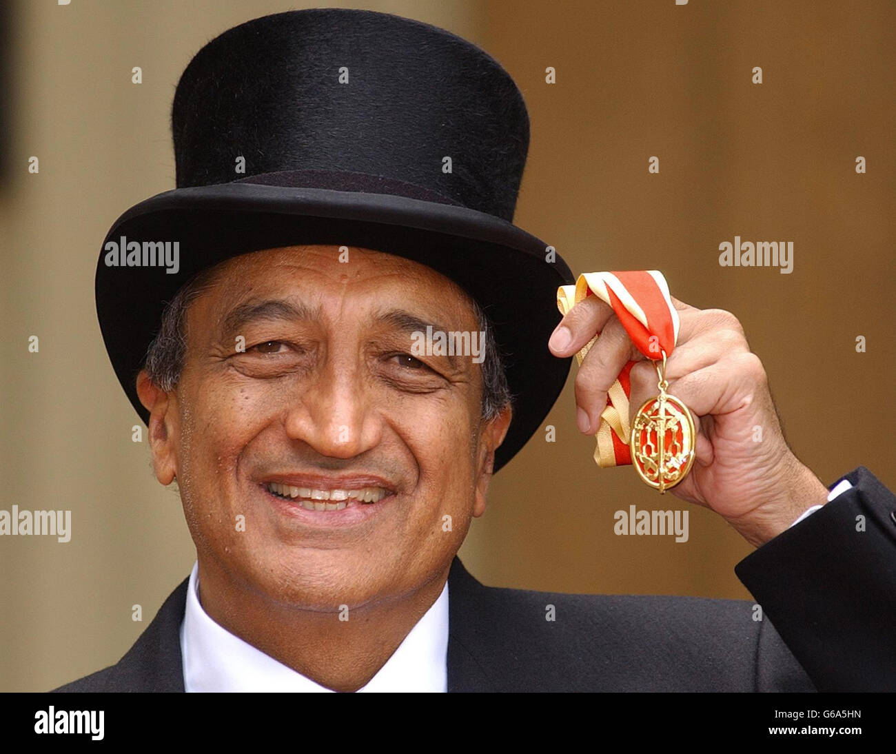 With his knighthood which he received from the queen hi-res stock ...