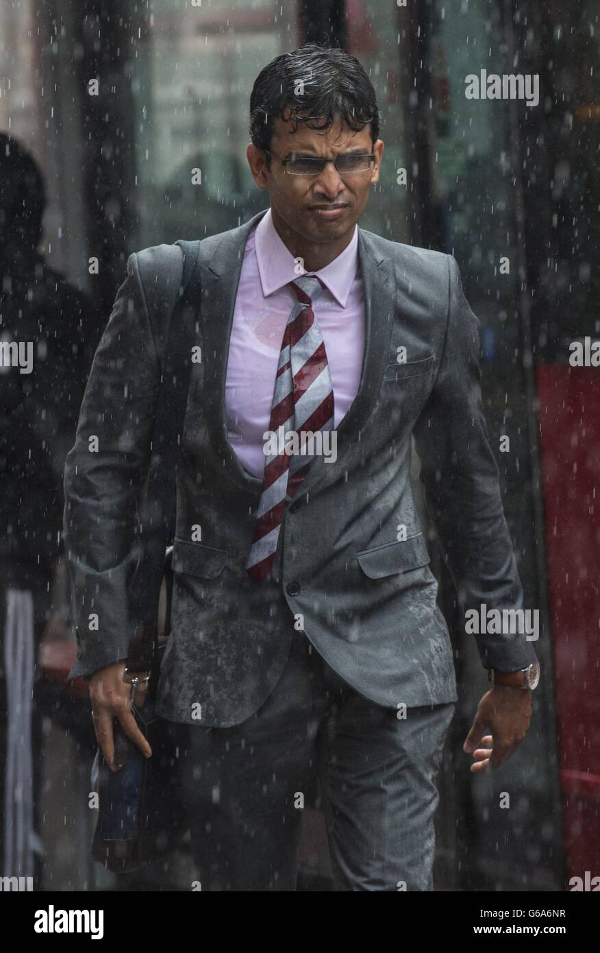 A man caught in the rain hi-res stock photography and images - Alamy