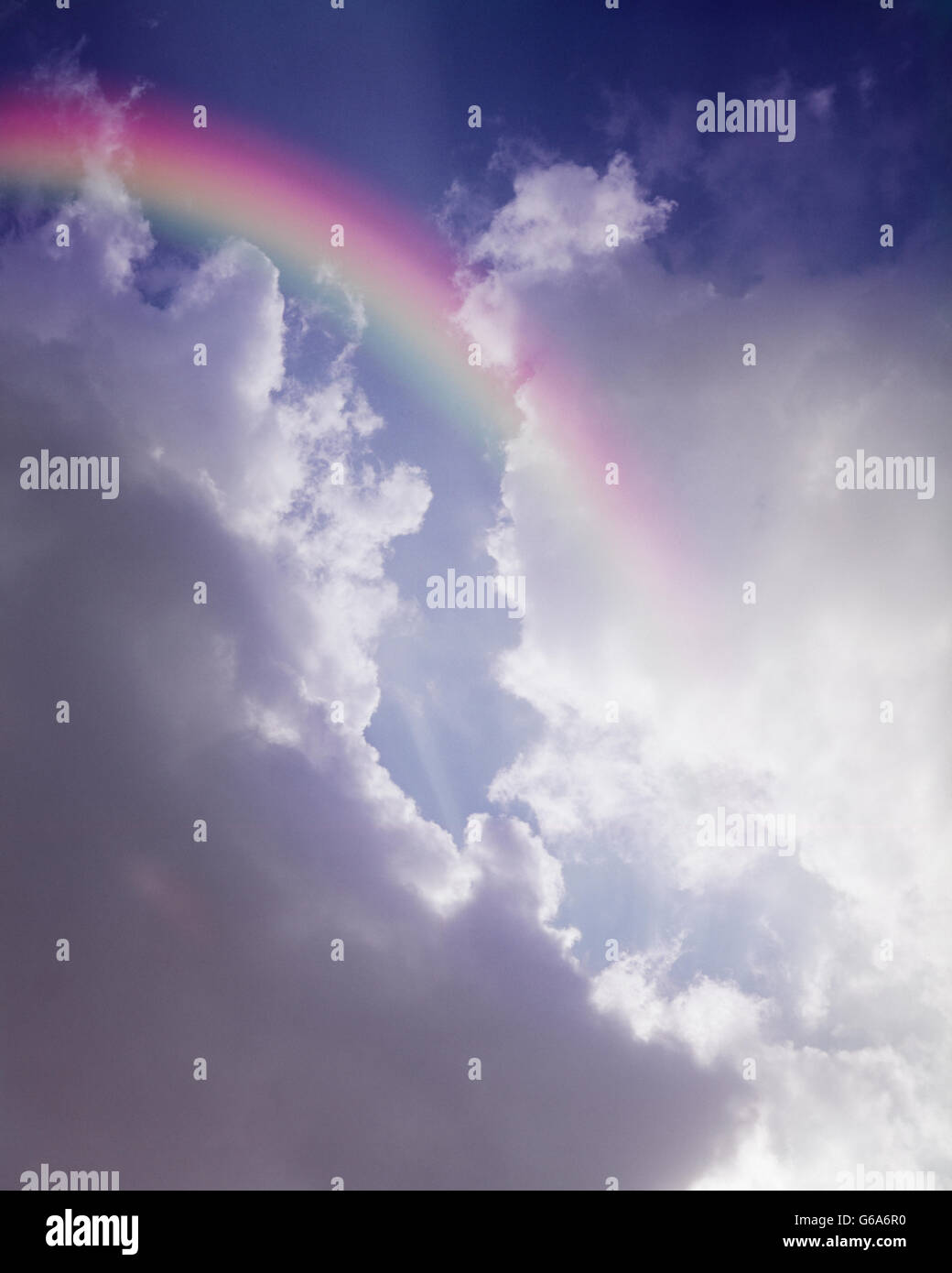 RAINBOW IN SKY WITH CLOUDS Stock Photo - Alamy