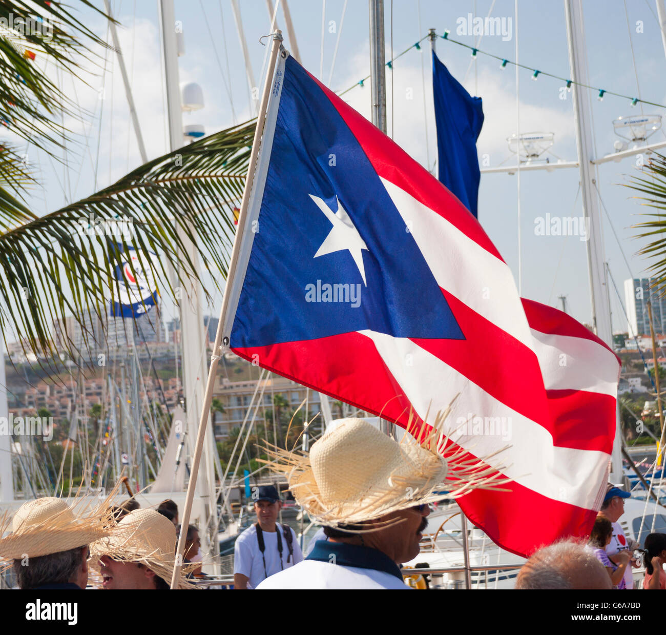 Cuban crew carrying Cuban flag at parade ahead of ARC transatlantic ...