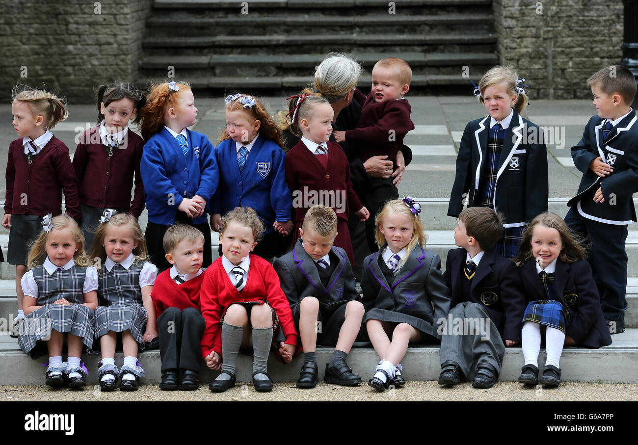 Owen McMillan from Lady Alice Primary is coaxed into a group photograph ...