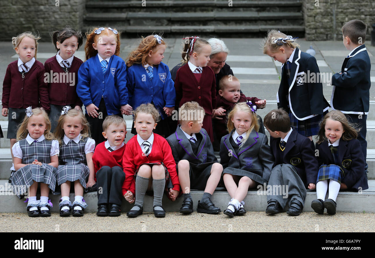 Owen McMillan from Lady Alice Primary is coaxed into a group photograph ...
